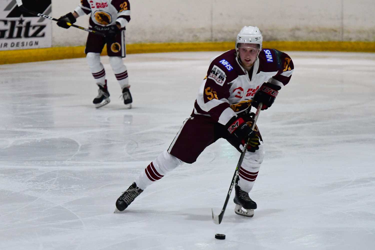 Queenan signs on for 7th season in Maroon and Gold